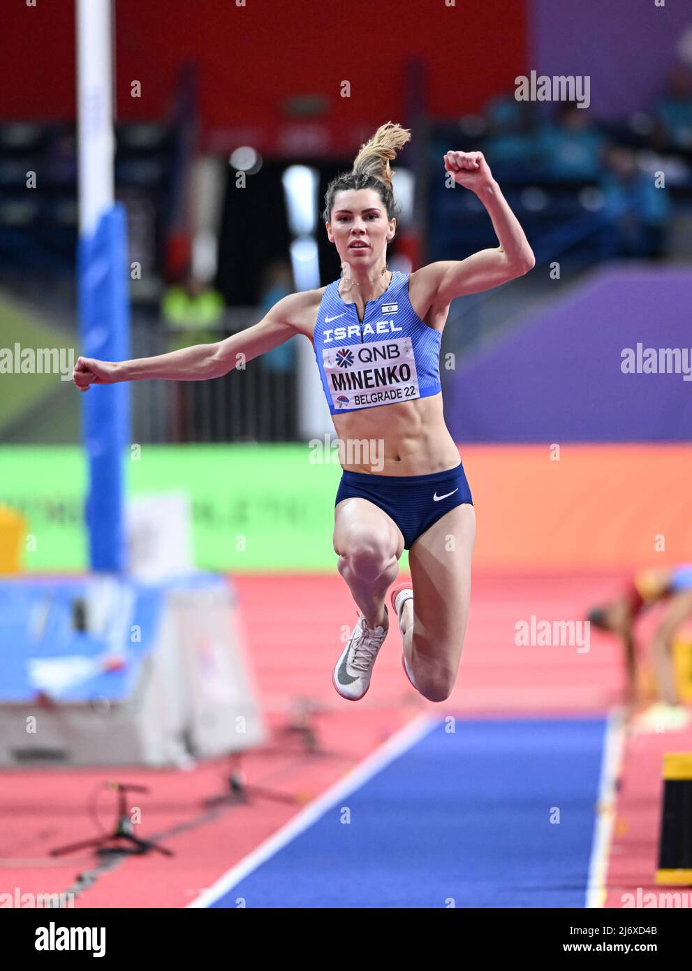 Hanna Minenko jumping at the Belgrade 2022 Indoor World Championship in ...