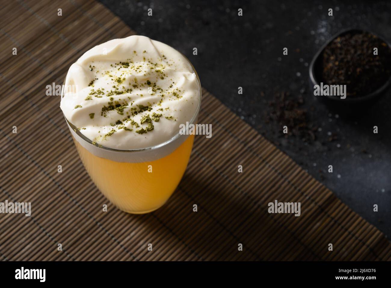 Chinese Cheese tea made of green tea with whipped cream cheese on black ...