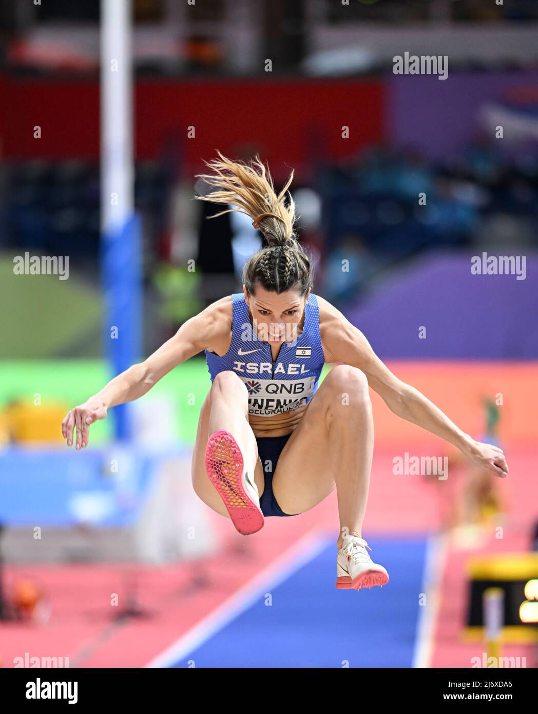 Hanna Minenko jumping at the Belgrade 2022 Indoor World Championship in ...
