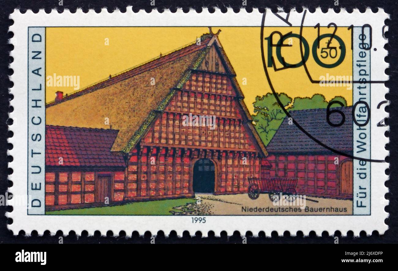 GERMANY - CIRCA 1995: a stamp printed in the Germany shows Farmhouse ...