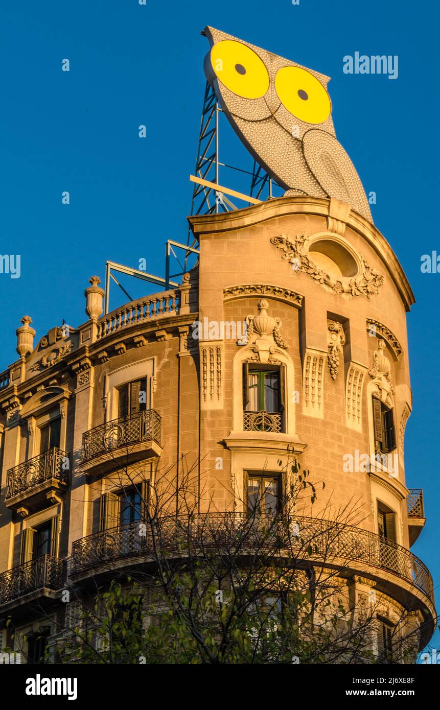 BARCELONA, SPAIN - DECEMBER 6, 2013: A large owl on a top of a building ...