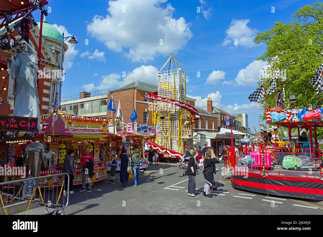 People enjoying the annual May fair in Boston on a sunny springtime day ...