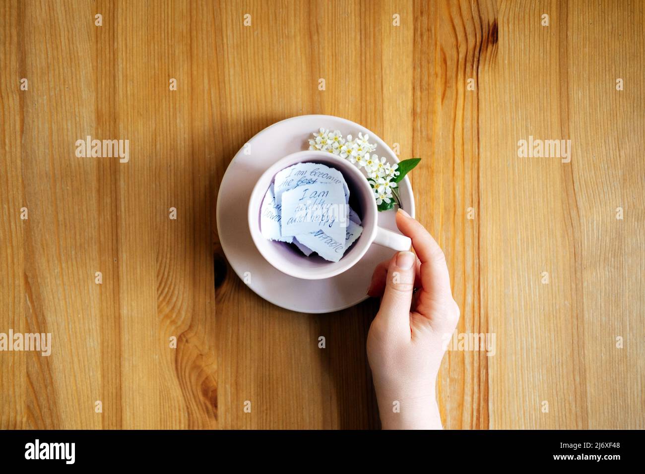 Affirmation, inspirational quotes concept. Female hand and paper with ...