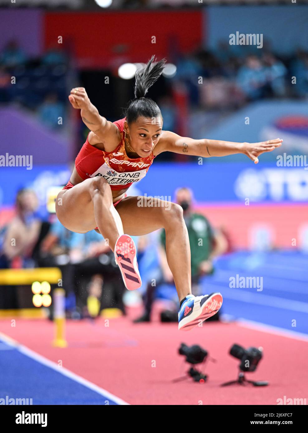 Ana Peleteiro jumping at the Belgrade 2022 Indoor World Championship in ...