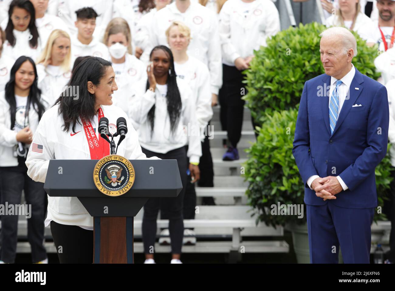 President Joe Biden listens as Olympic bobsledder Elana Meyers Taylor ...