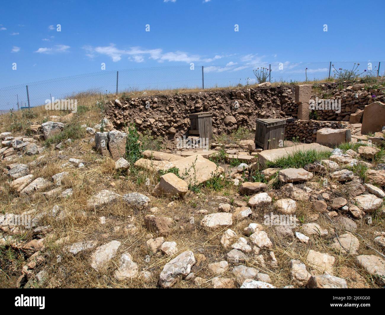 Gobekli Tepe is an archaeological site at the top of a mountain ridge ...