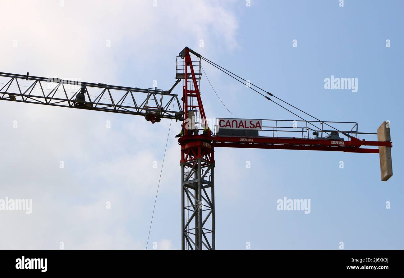 Horizontal jib of a tower crane being lifted into position by a truck ...