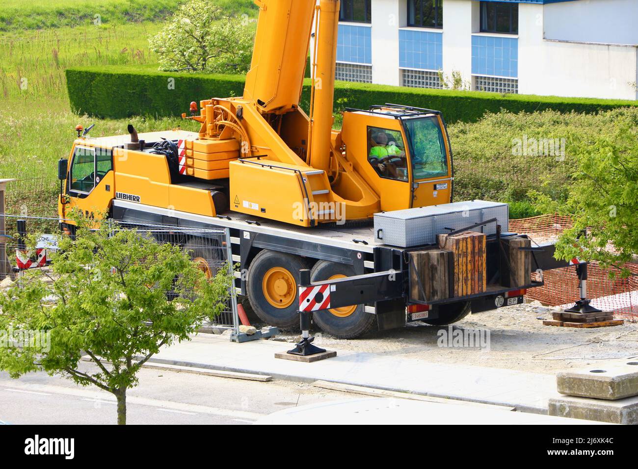 A Liebherr truck mounted telescopic jib crane in use during the ...