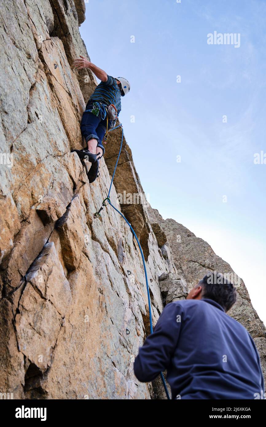 A Climbers practicing rock climbing on a rock face Stock Photo - Alamy