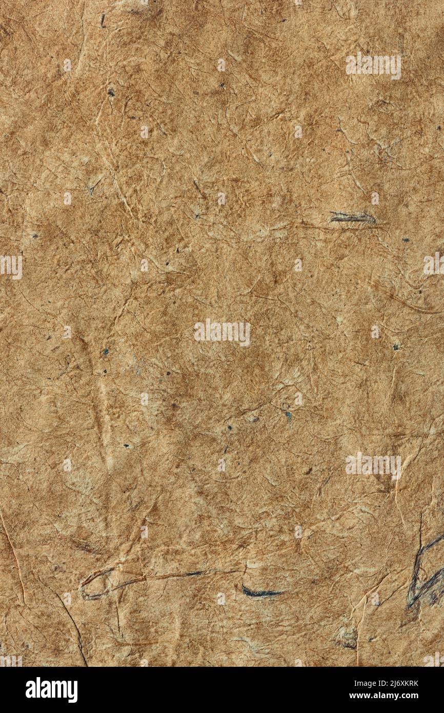 Textured brown wrinkled handmade paper background. Vertical background ...