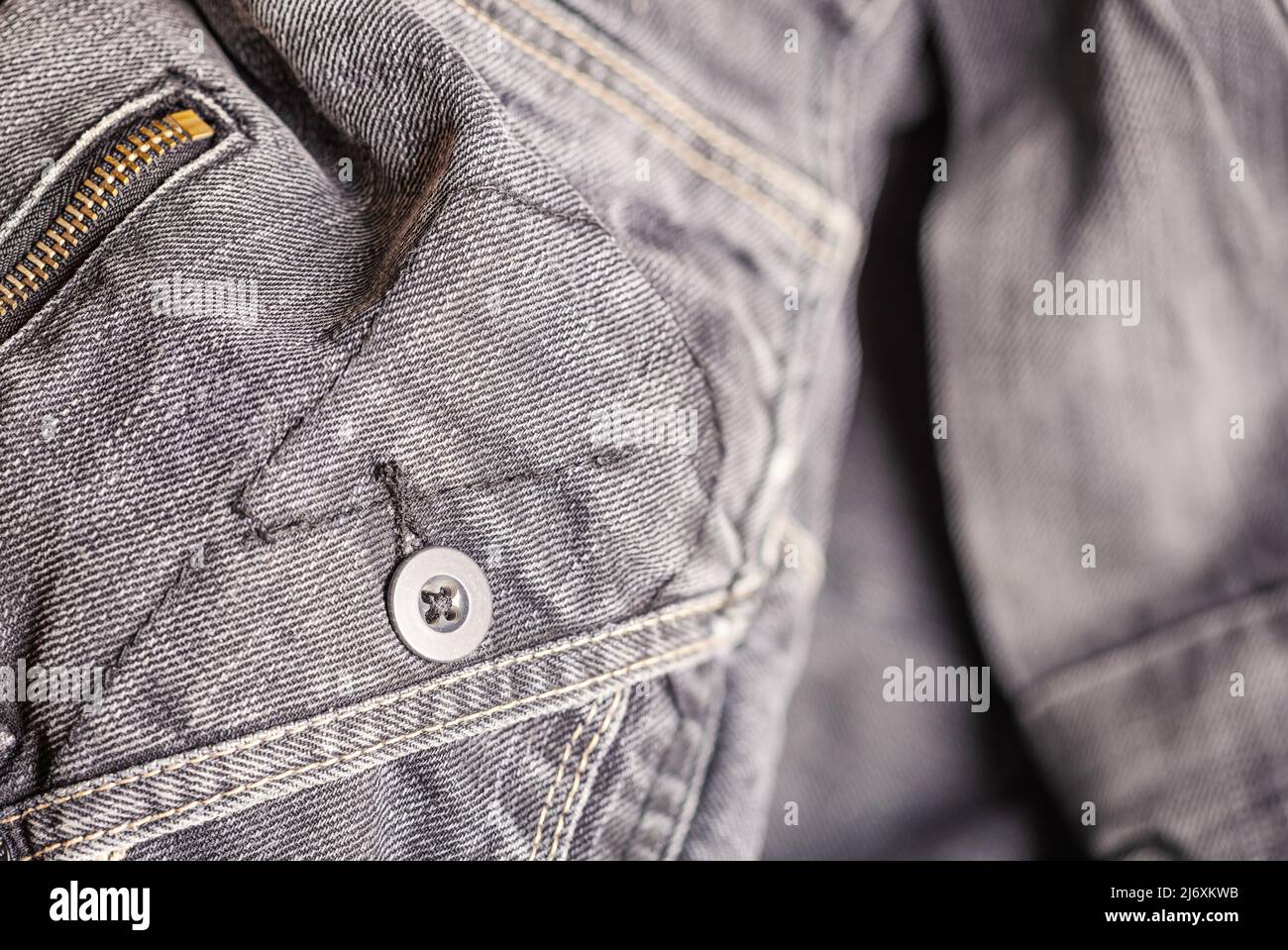 A denium gray jean closeup, with space for text. View of old jeans ...