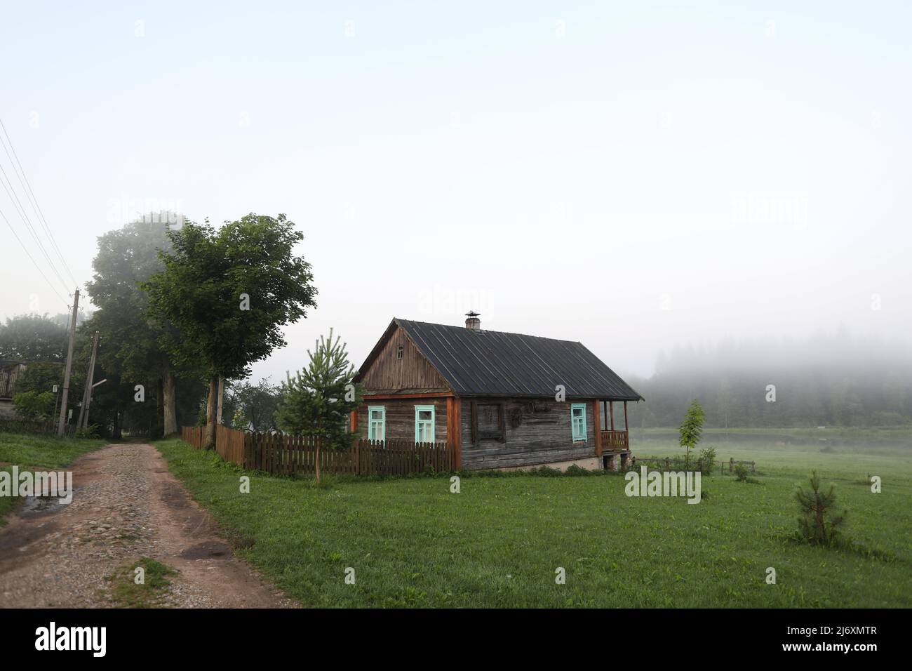 summer picturesque rustic landscape with wooden house on sunrise Stock ...
