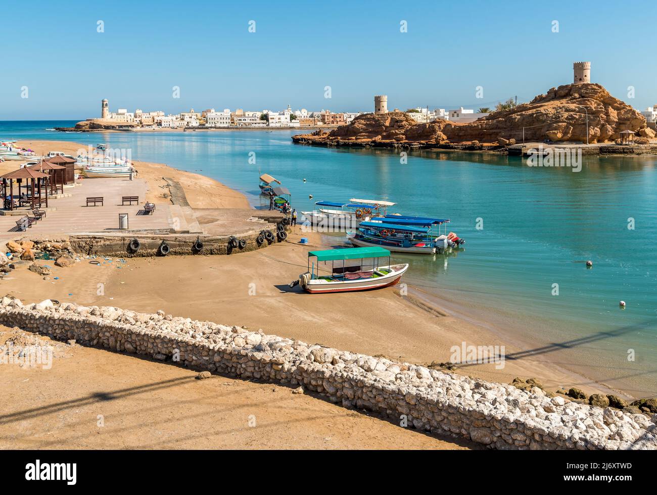 View of bay of Sur with Al Ayjah Lighthouse, forts on the rocks and ...