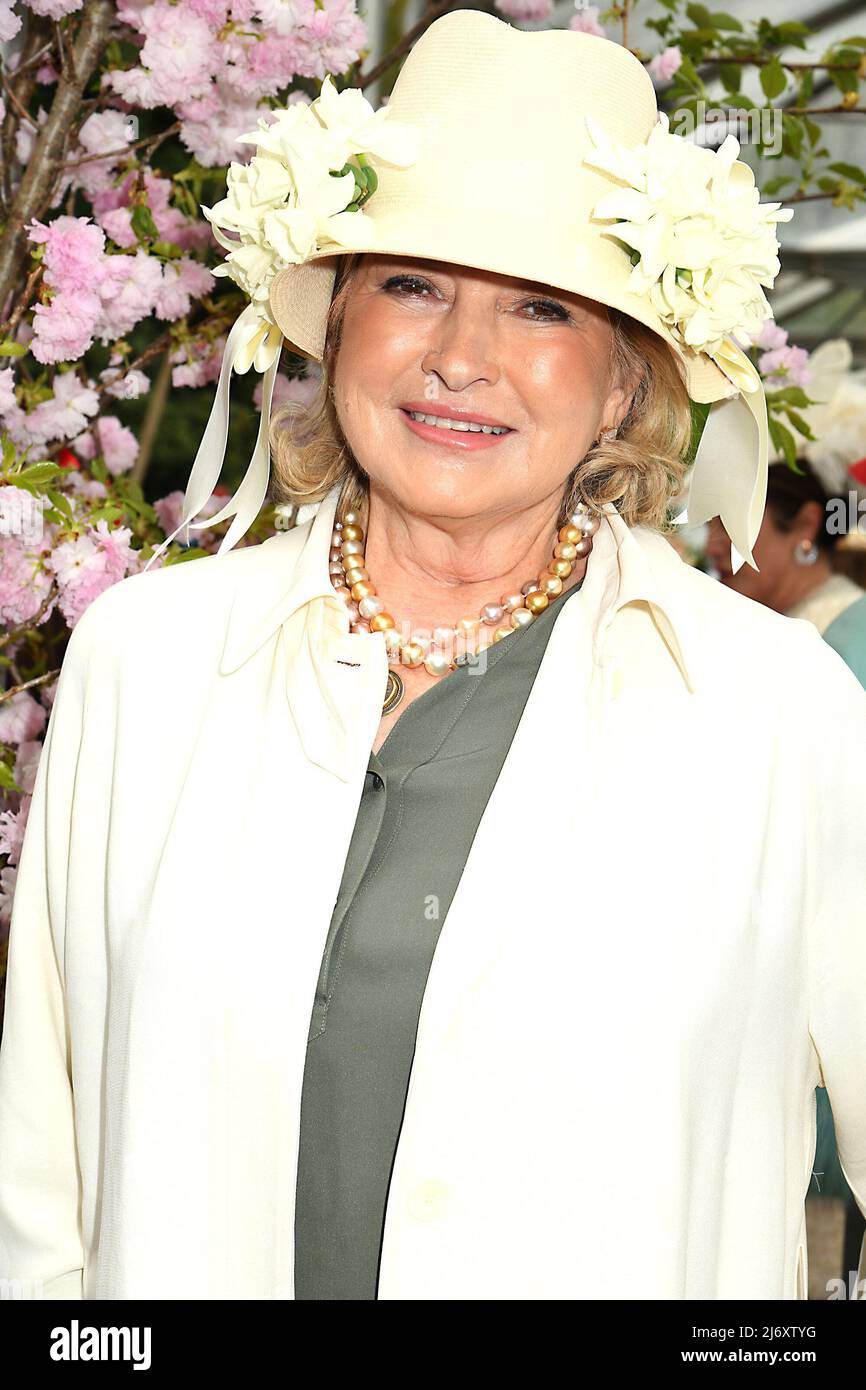Martha Stewart, in hat with flowers that she put on herself, attends ...