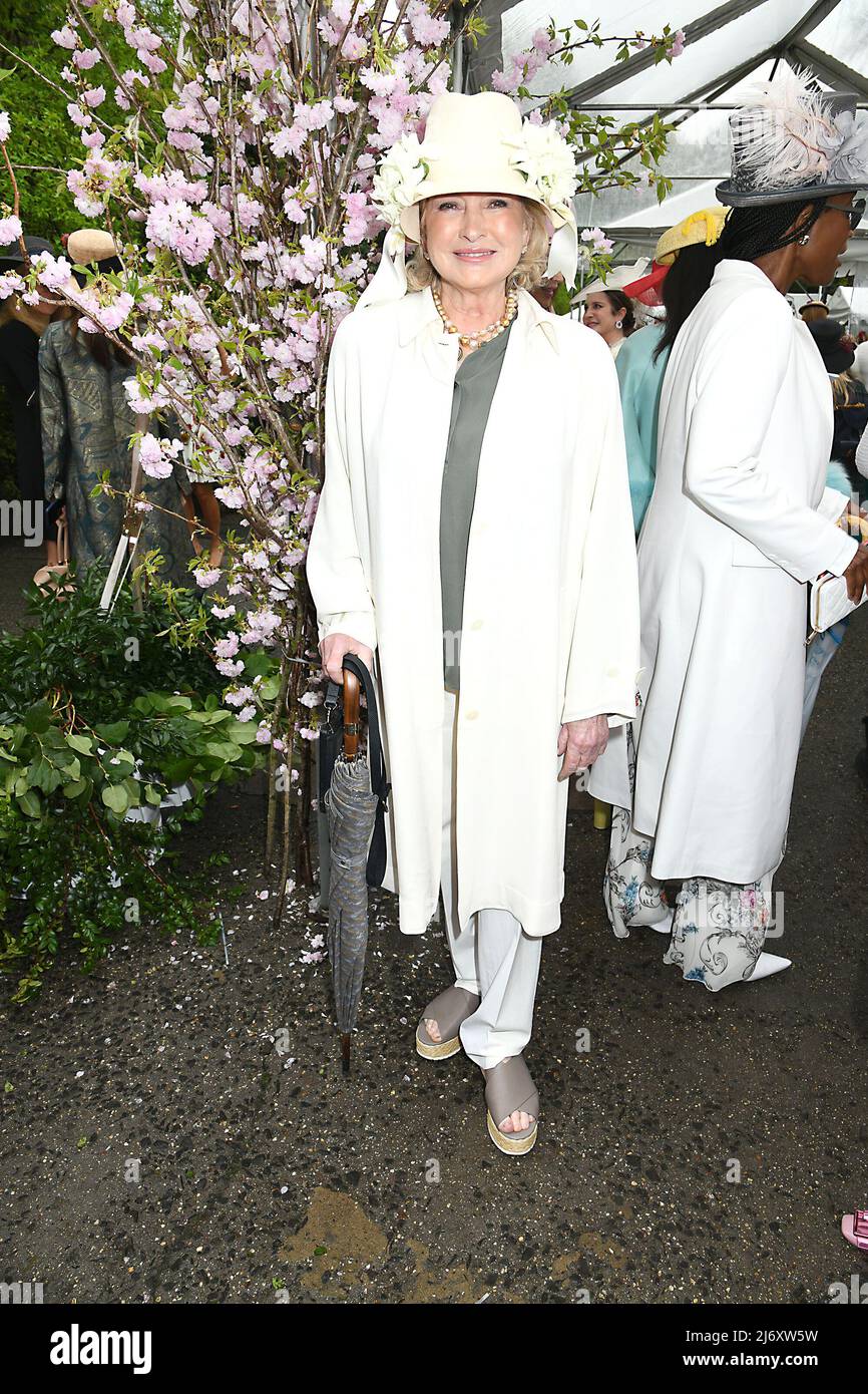 Martha Stewart, in hat with flowers that she put on herself, attends ...