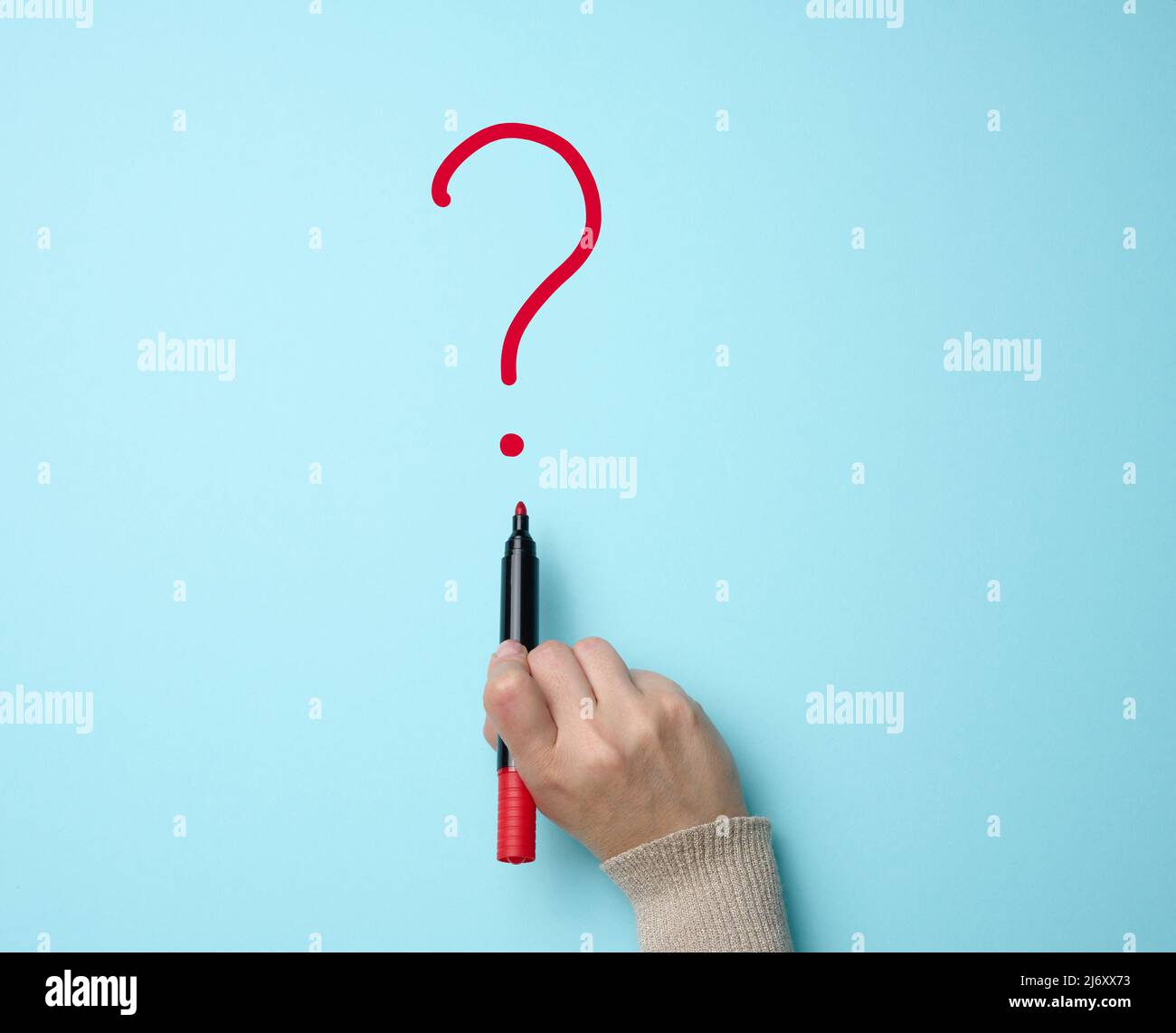 Hand drawn question mark with a red marker on a blue background. Search ...