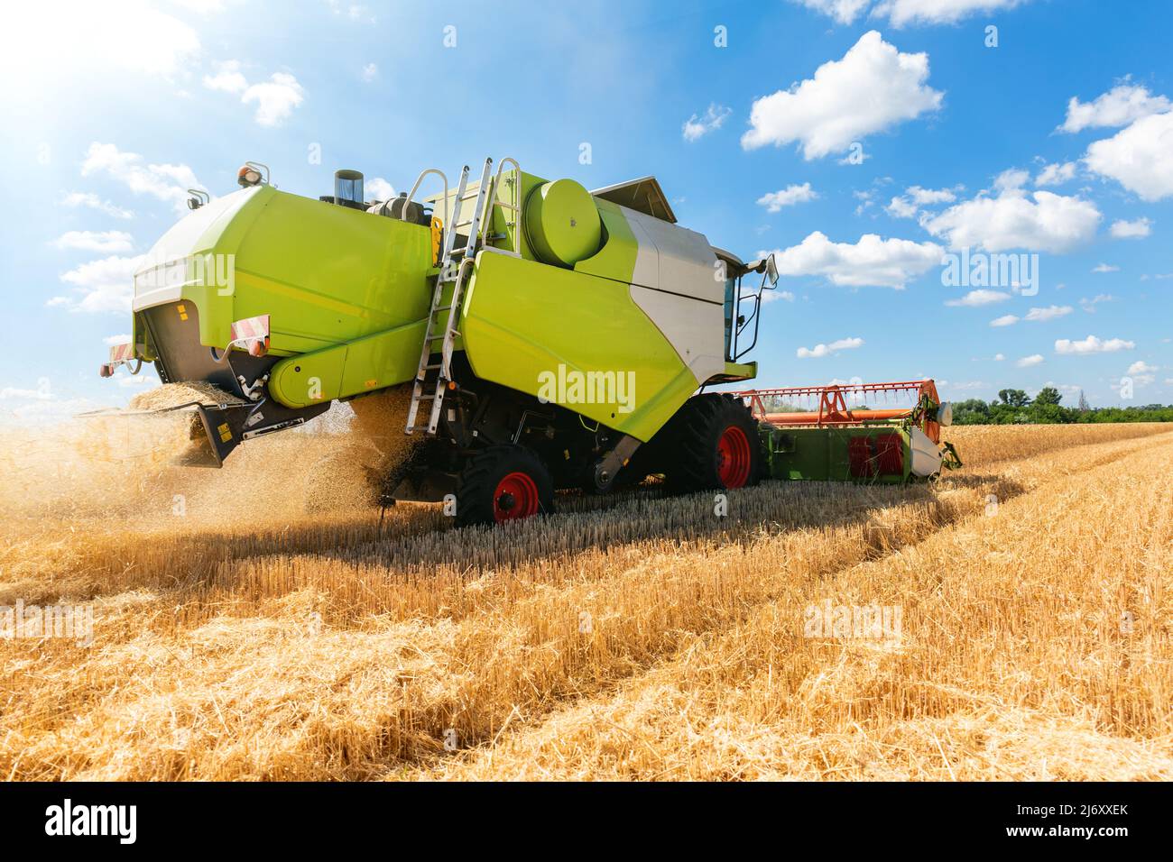 Scenic side view Big powerful industrial combine harvester machine ...