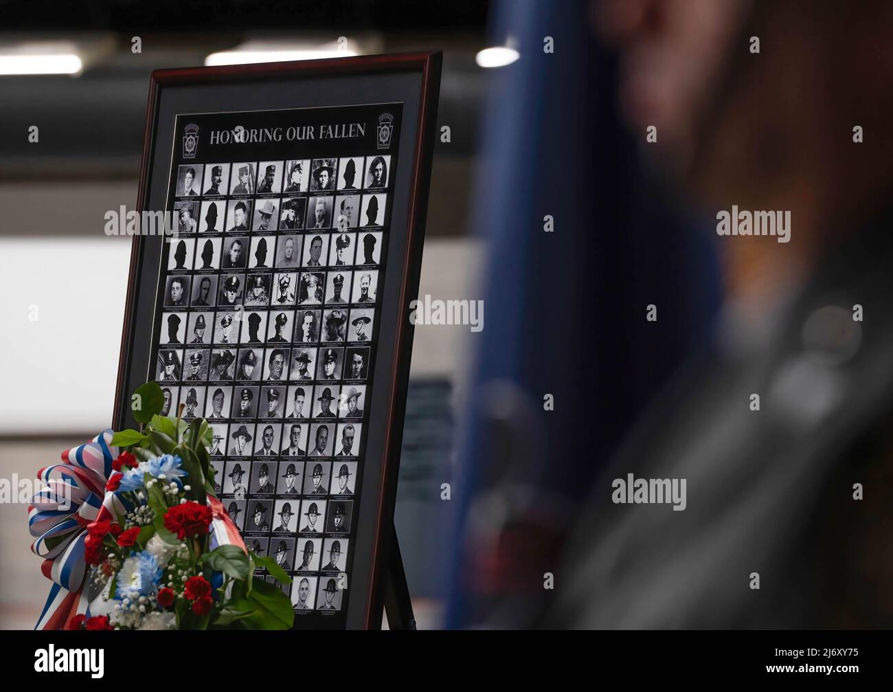 A plaque with images of the fallen Pennsylvania State Police stands in ...