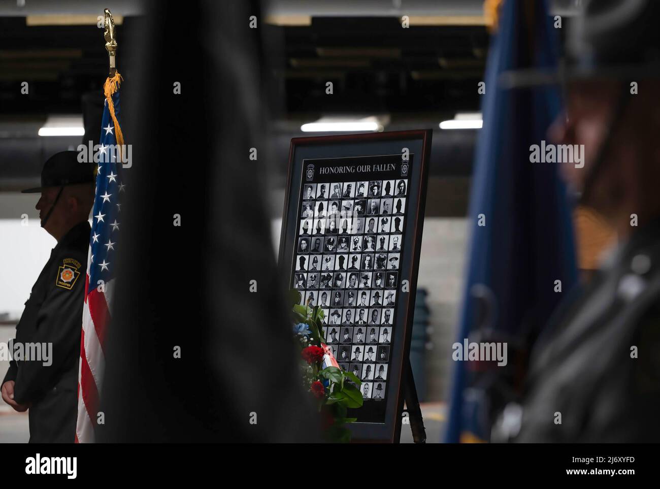 A plaque with images of the fallen Pennsylvania State Police stands in ...