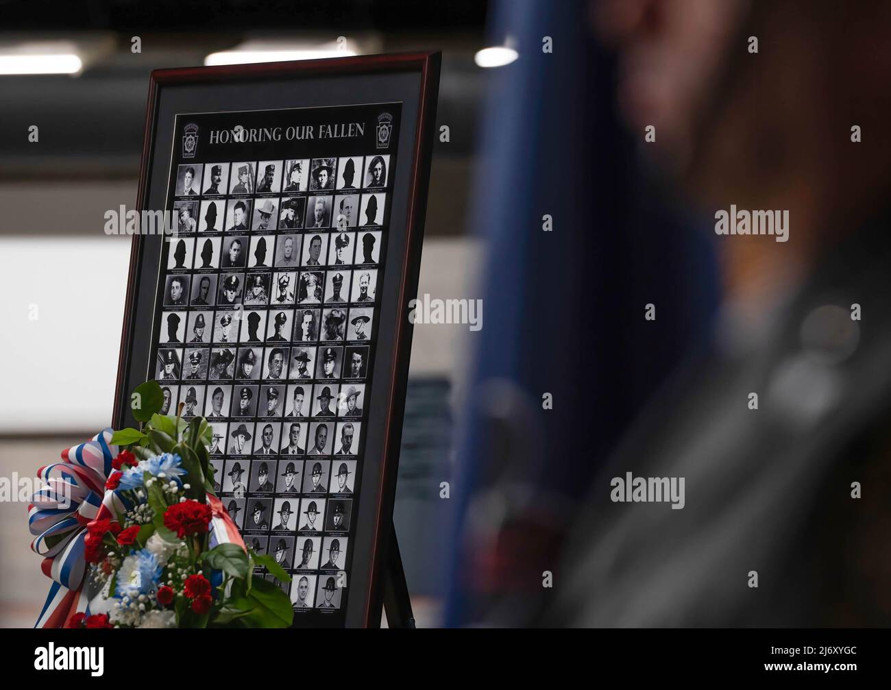 A plaque with images of the fallen Pennsylvania State Police stands in ...