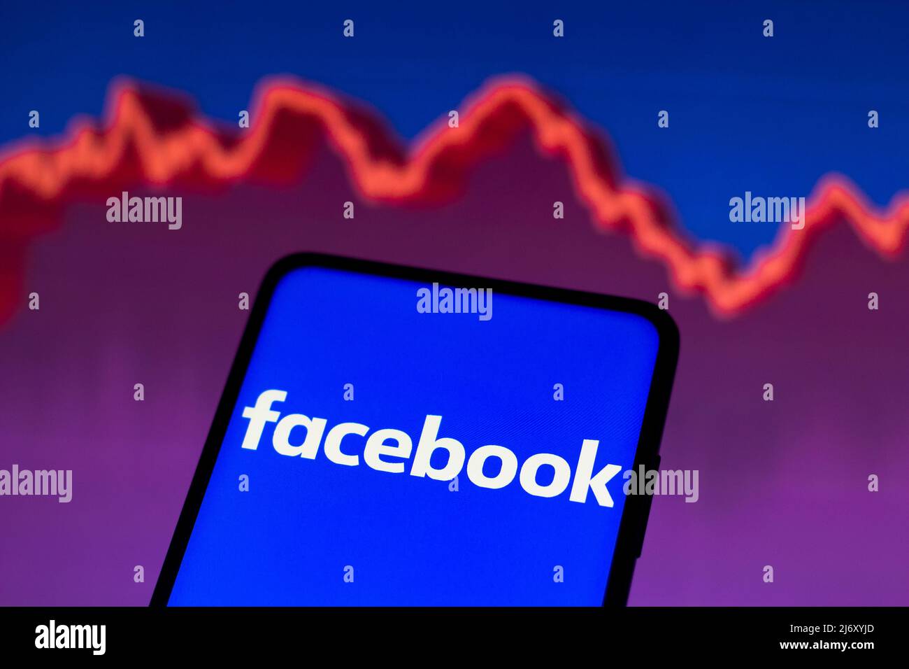 In this photo illustration the Facebook logo seen displayed on a ...
