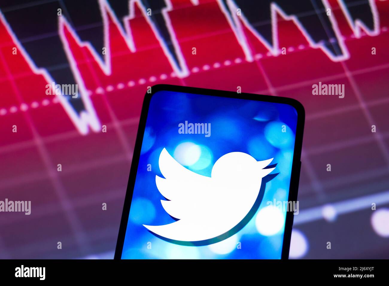 In this photo illustration the Twitter logo seen displayed on a ...