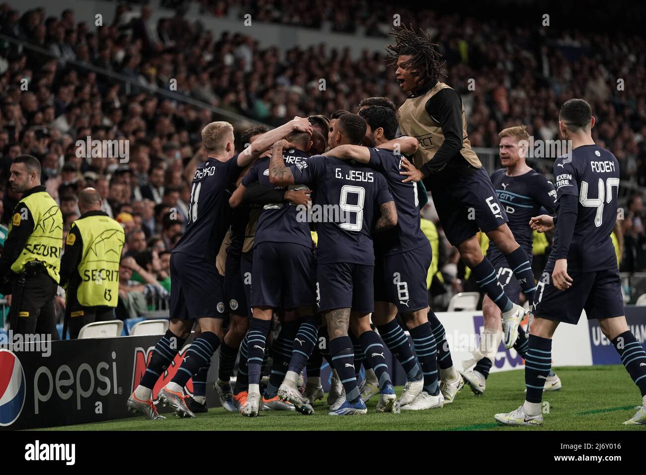 Manchester City's Riyad Mahrez is mobbed by team mates after scoring ...