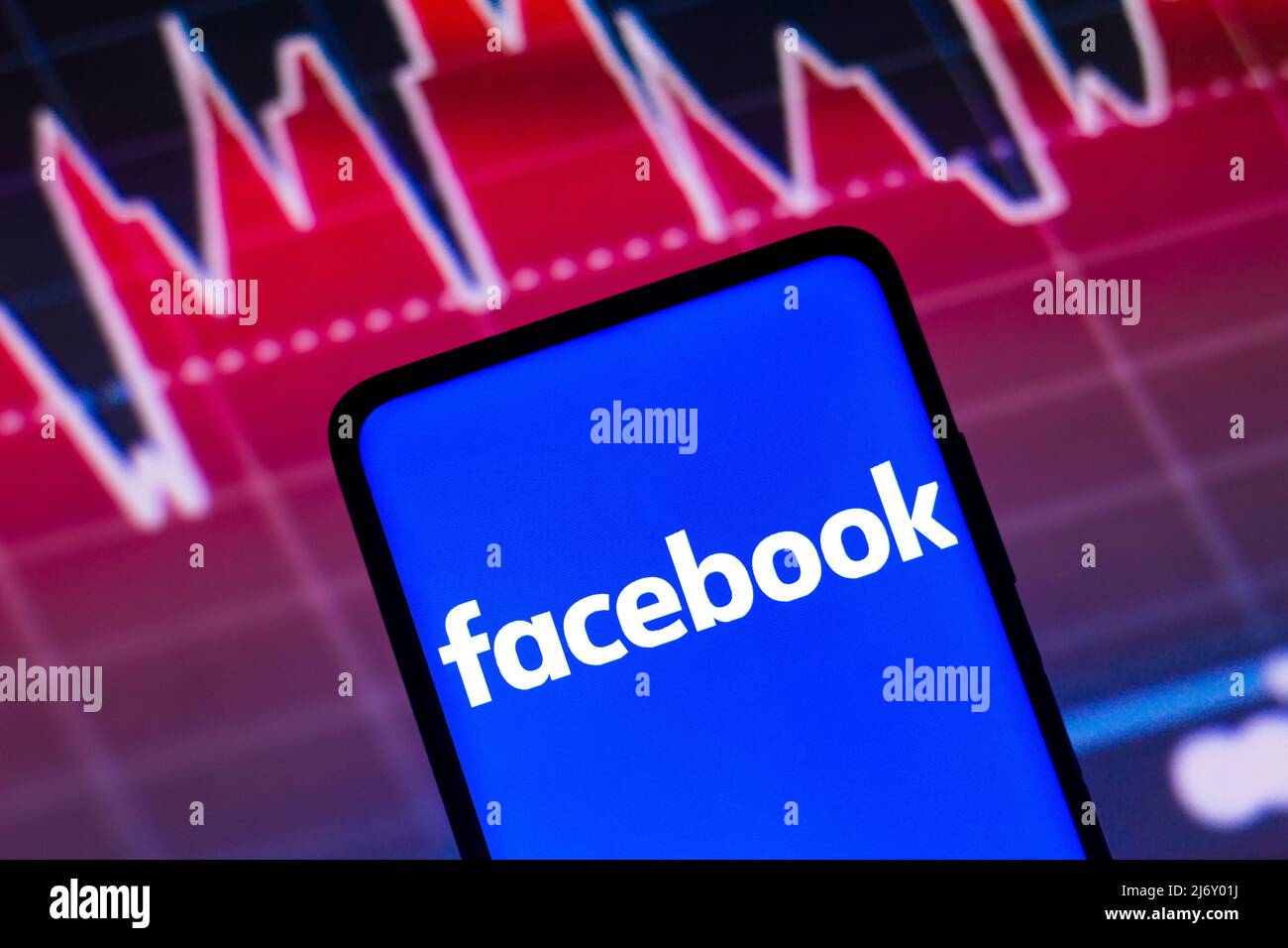 In this photo illustration the Facebook logo seen displayed on a ...