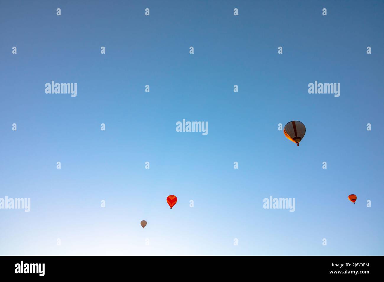 Hot air balloons on the sky in the morning. Ballooning activity background photo Stock Photo - Alamy