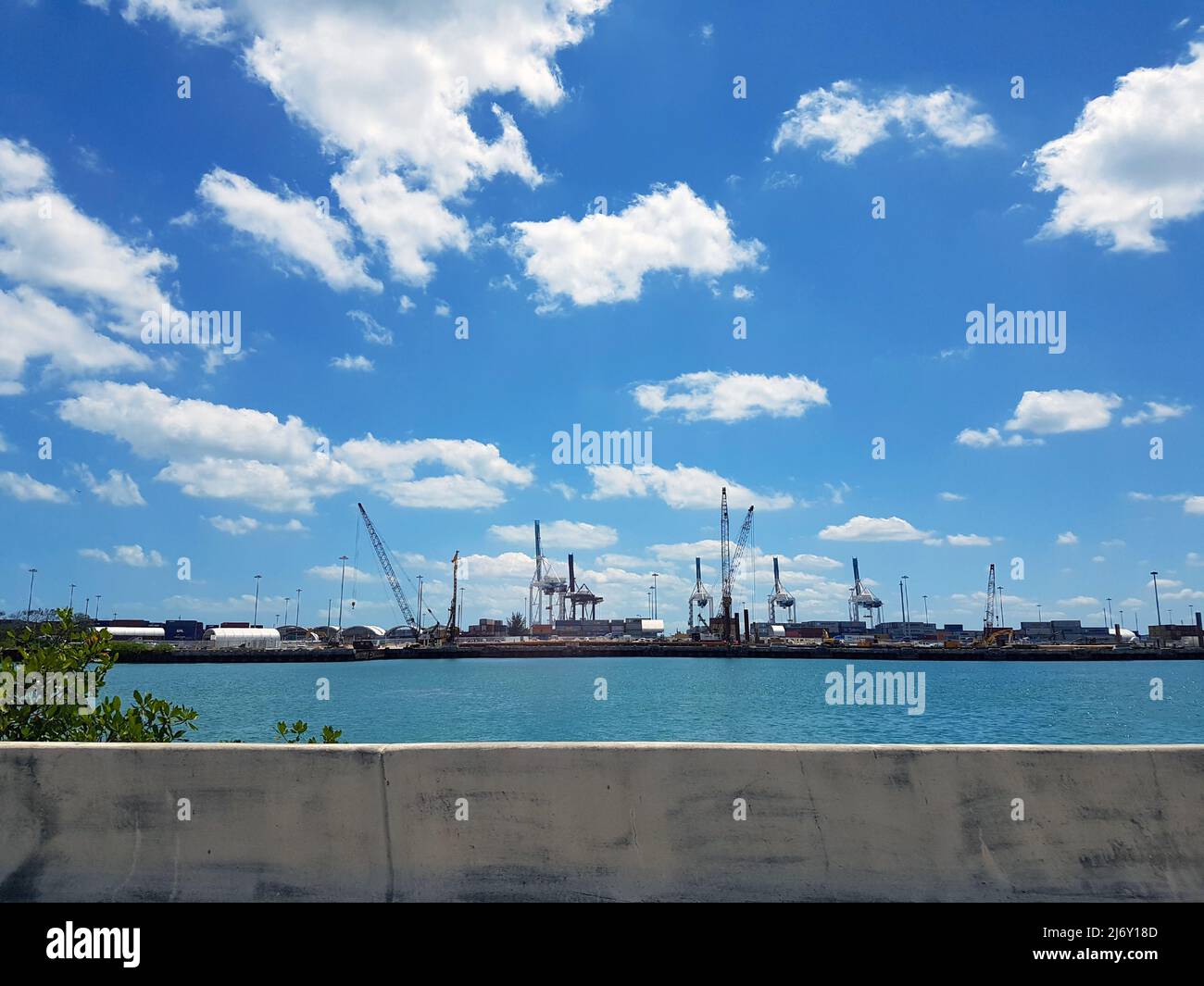 Cargo port in Miami view from a passing car on the highway in clear ...