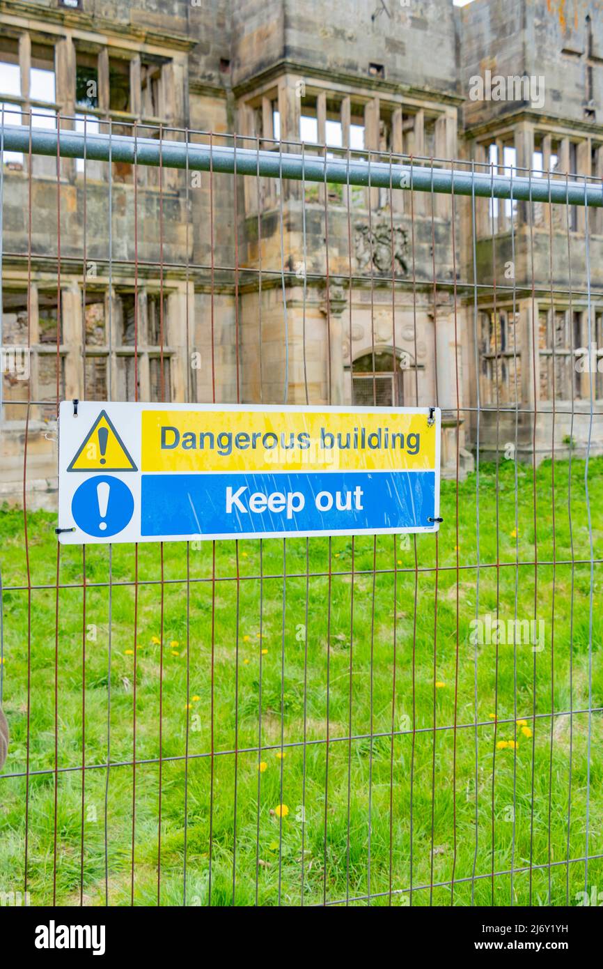 ruined historic house and orangery behind wire fence at Gibside Consett ...