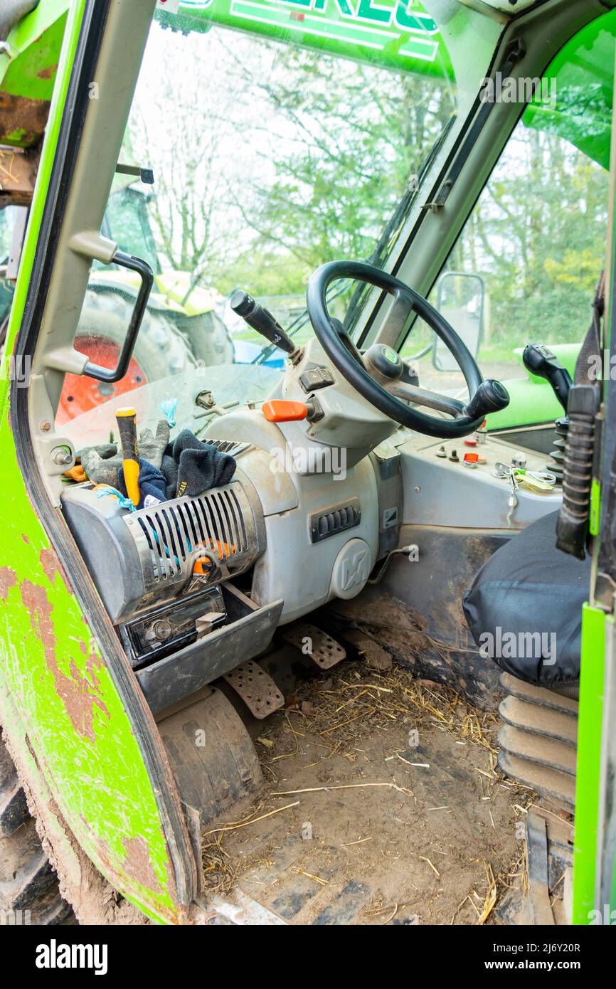 inside of cab of green telescopic handler on farm in northumberland ...