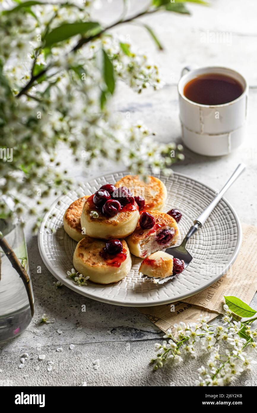 Syrniki - traditional Russian cheese pancakes served for breakfast with ...