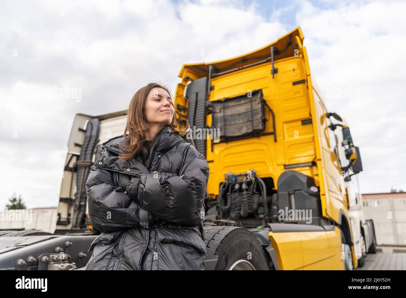 Caucasian young woman driving truck. trucker female worker, transport ...