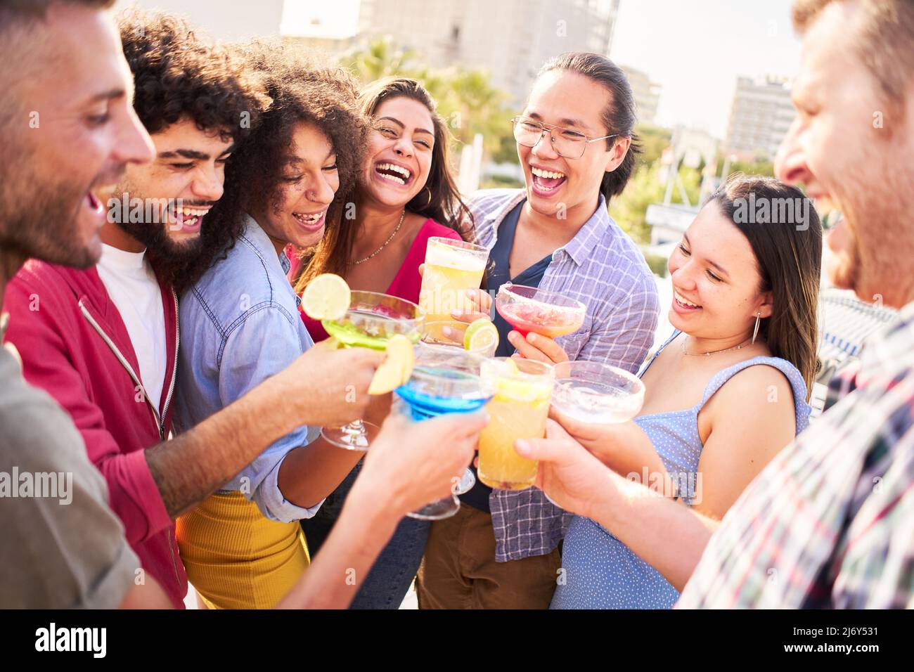 Group of happy friends drinking and toasting cocktails at brewery bar ...