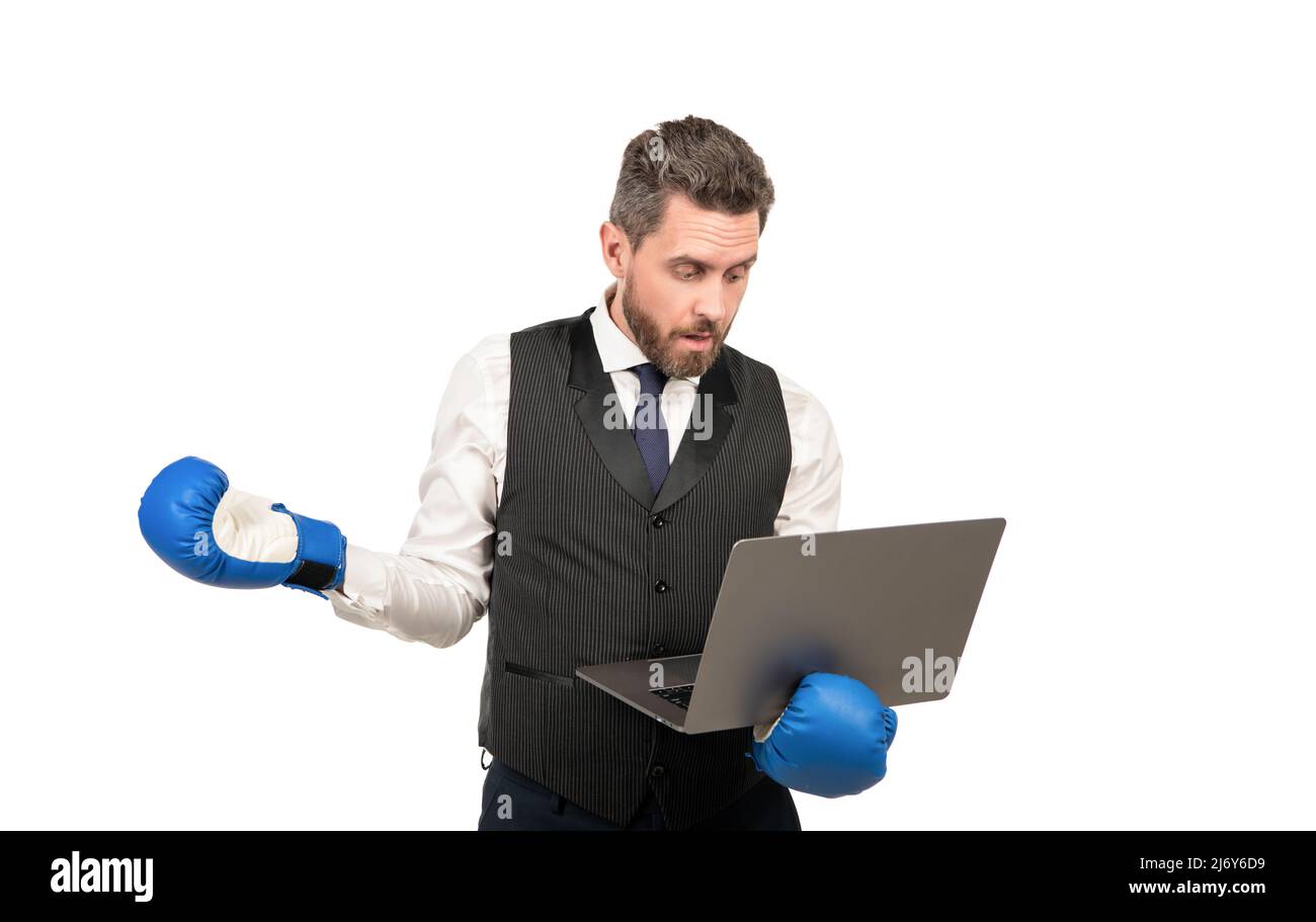 amazed man in boxing gloves and suit hold laptop isolated on white ...