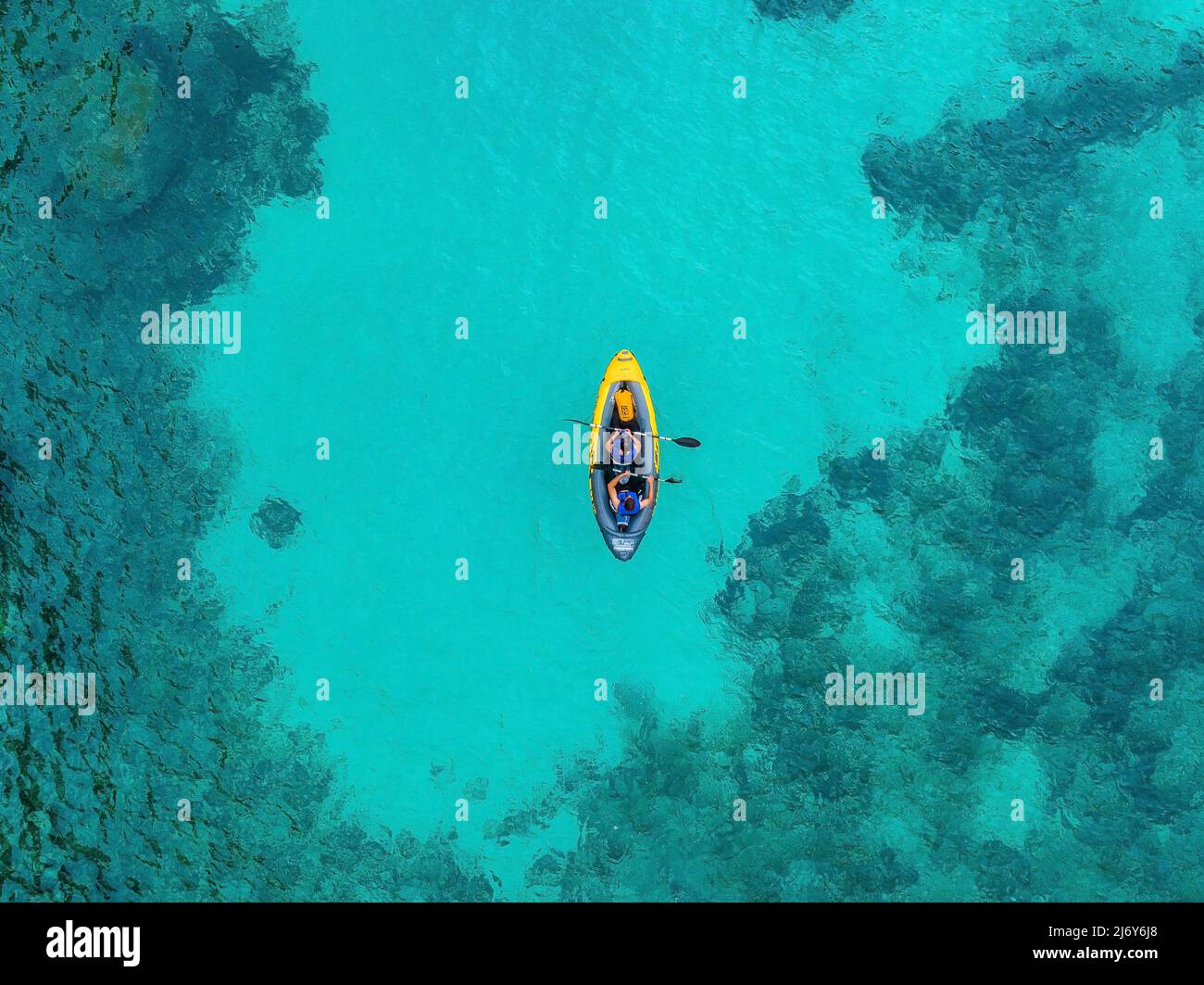 Aerial view of yellow kayak in blue lagoon at summer Stock Photo - Alamy