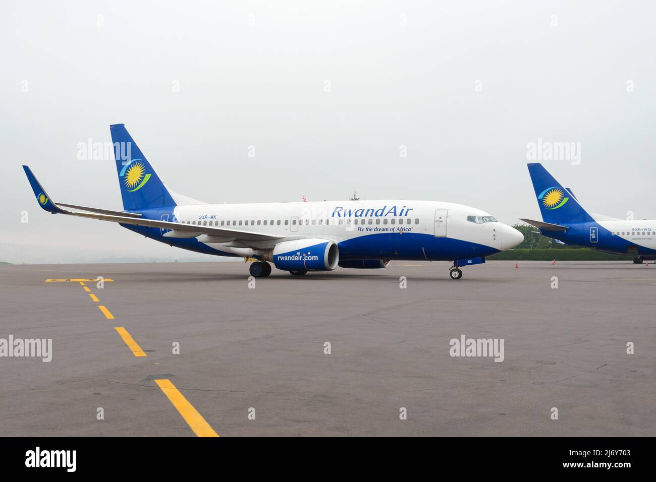 Rwandair Boeing 737 aircraft taxiing at Kigali Airport in Rwanda. Airplane of national airline ...