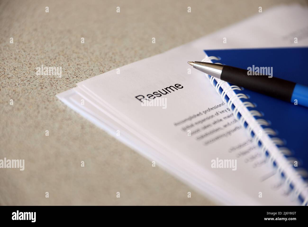 Top view of stack of office documents including resume and cv forms on ...