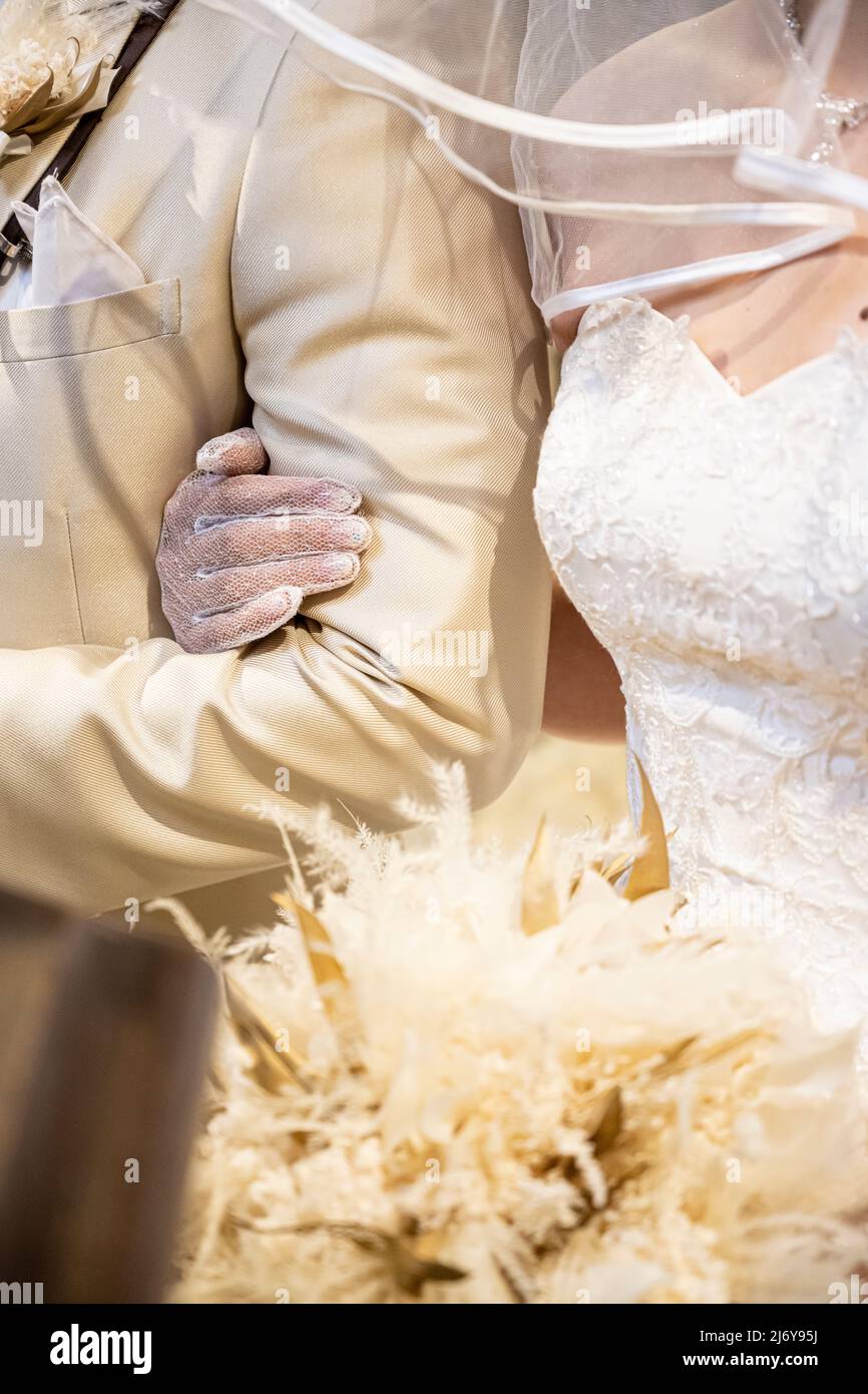 I took a picture of the bride and groom crossing their arms at the ...