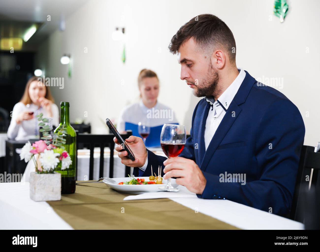 Gentleman is having dinner in luxury restaurante Stock Photo - Alamy