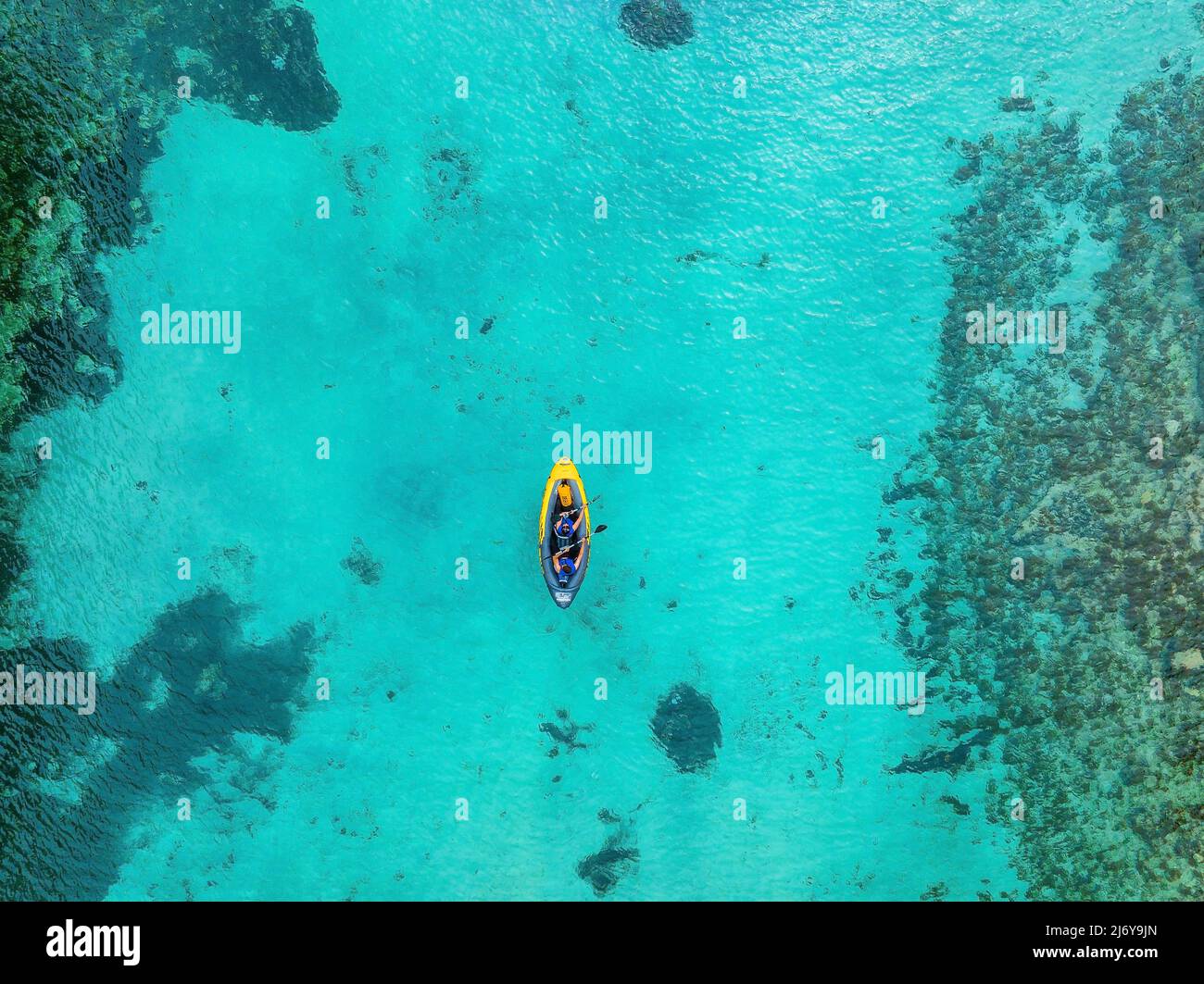 Aerial view of yellow kayak in blue lagoon at summer Stock Photo - Alamy