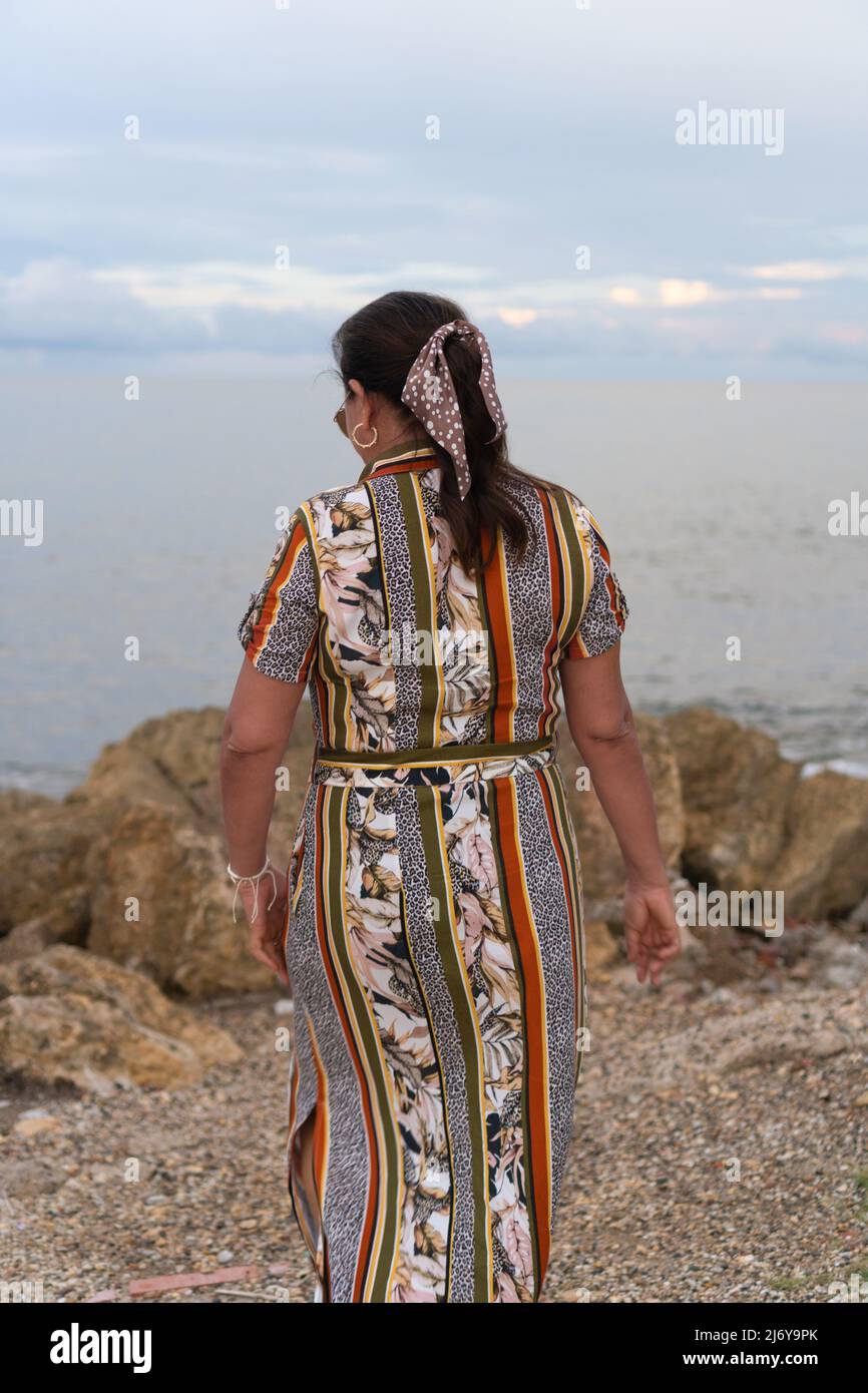 Woman Walking On The Street, Back View Stock Photo - Alamy