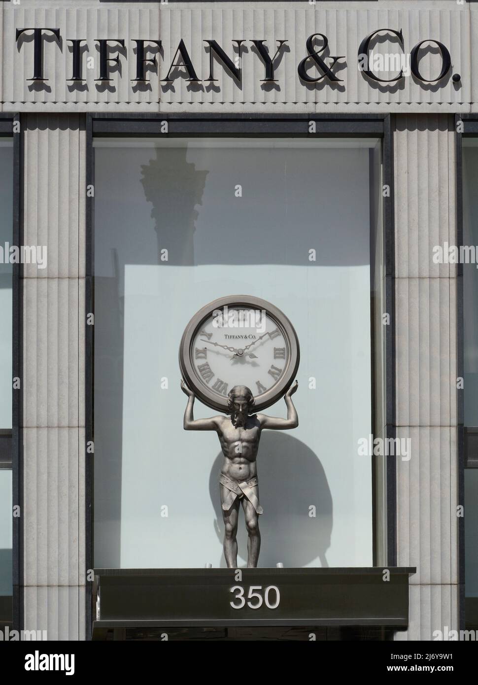 A clock in the form of Greek god Atlas holding the world in front of a ...