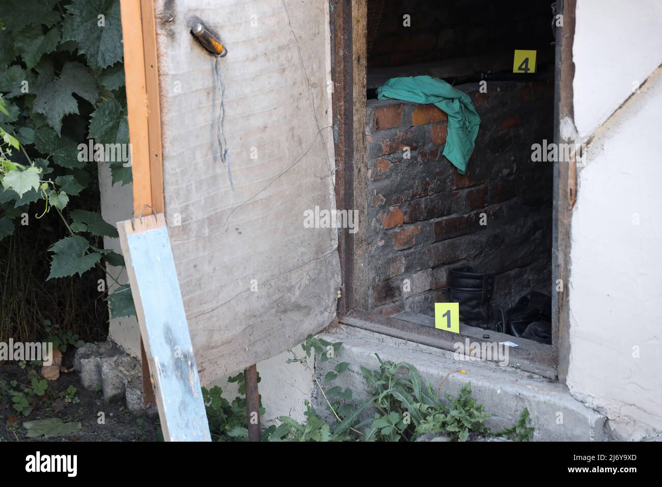 Evidence with yellow CSI marker for evidence numbering on the ...