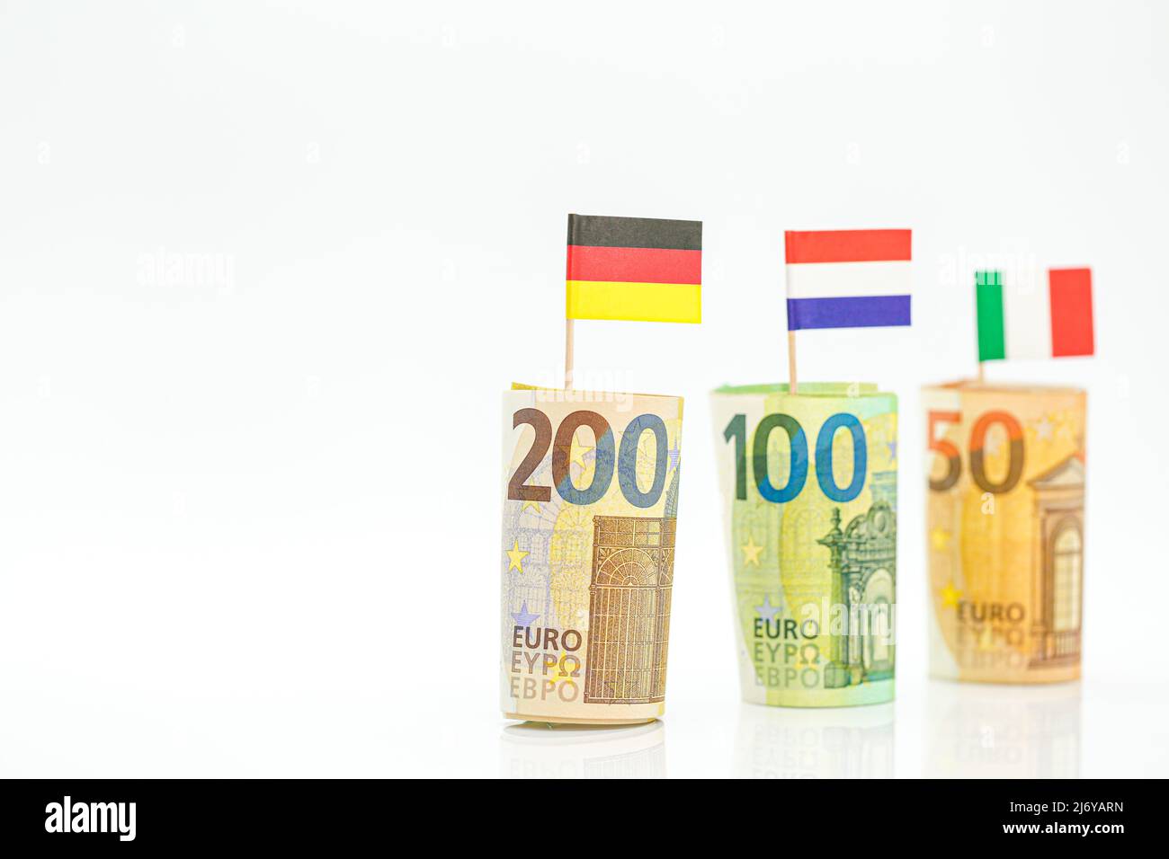 Money and flags of European countries.Flags of Germany, France and ...