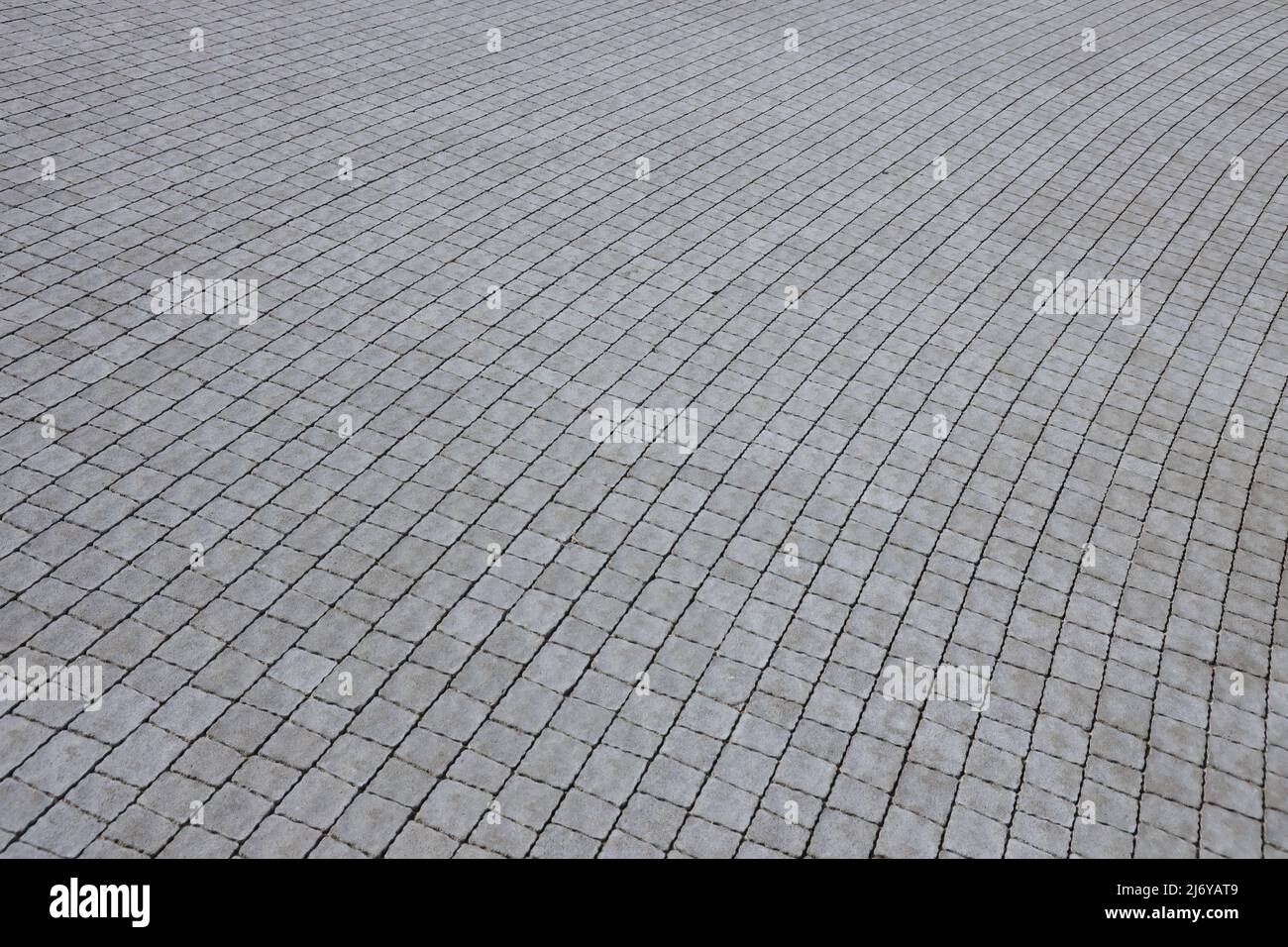 Gray color paving slabs in the pedestrian street sidewalk. Rough ...
