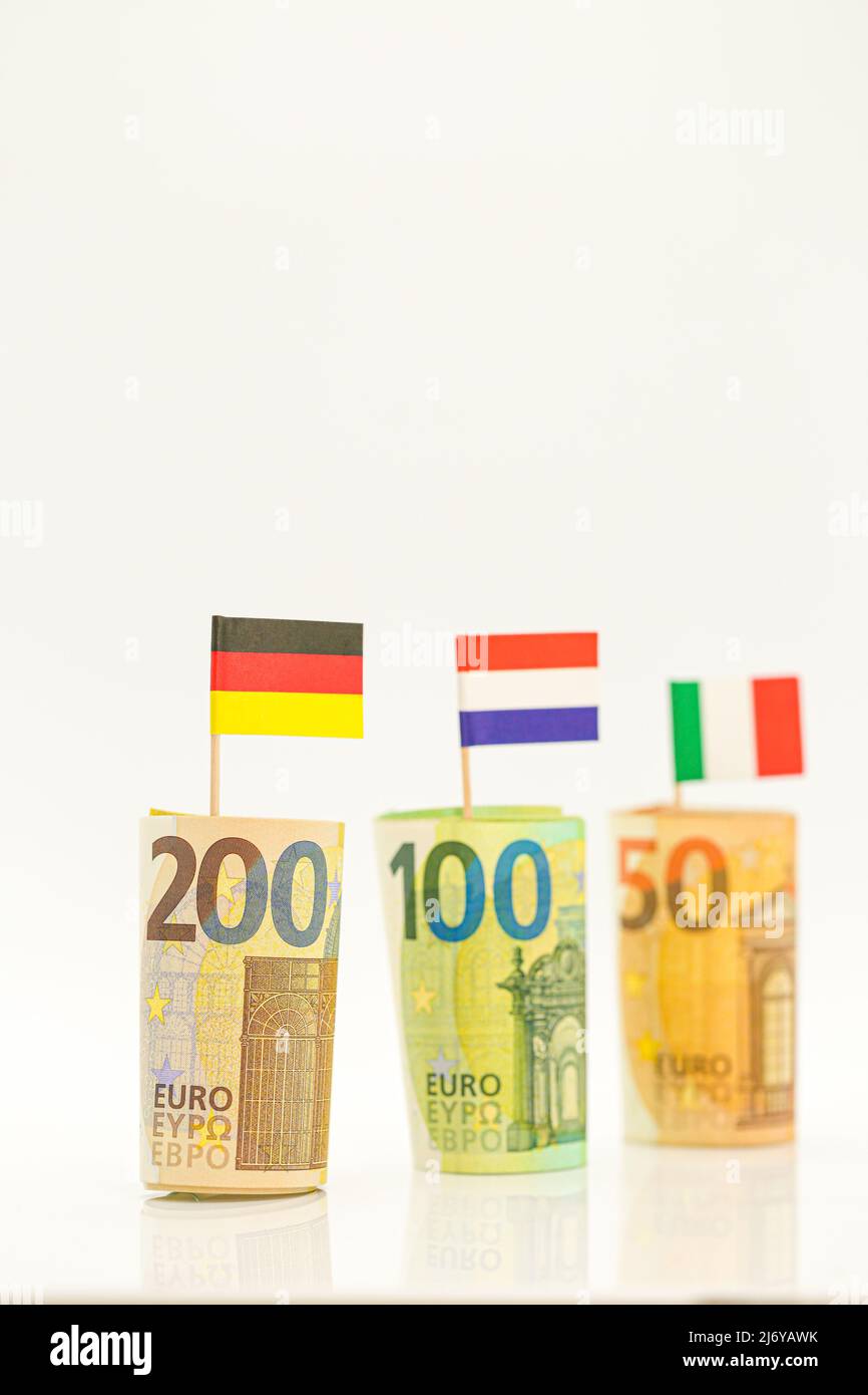 Money and flags of European countries.Flags of Germany, France and ...