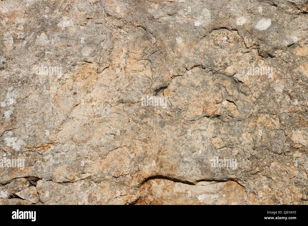 Closeup of the rough stone texture of a big rock surface for natural ...