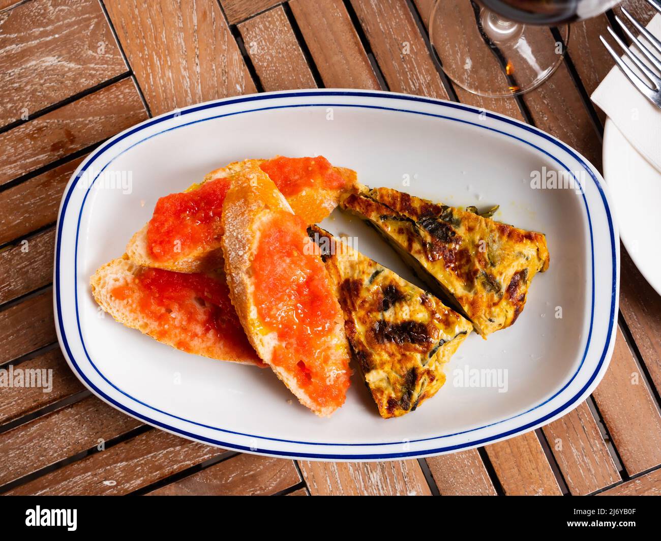 Catalan dishes an omelette of courgette and tomato bread Stock Photo ...